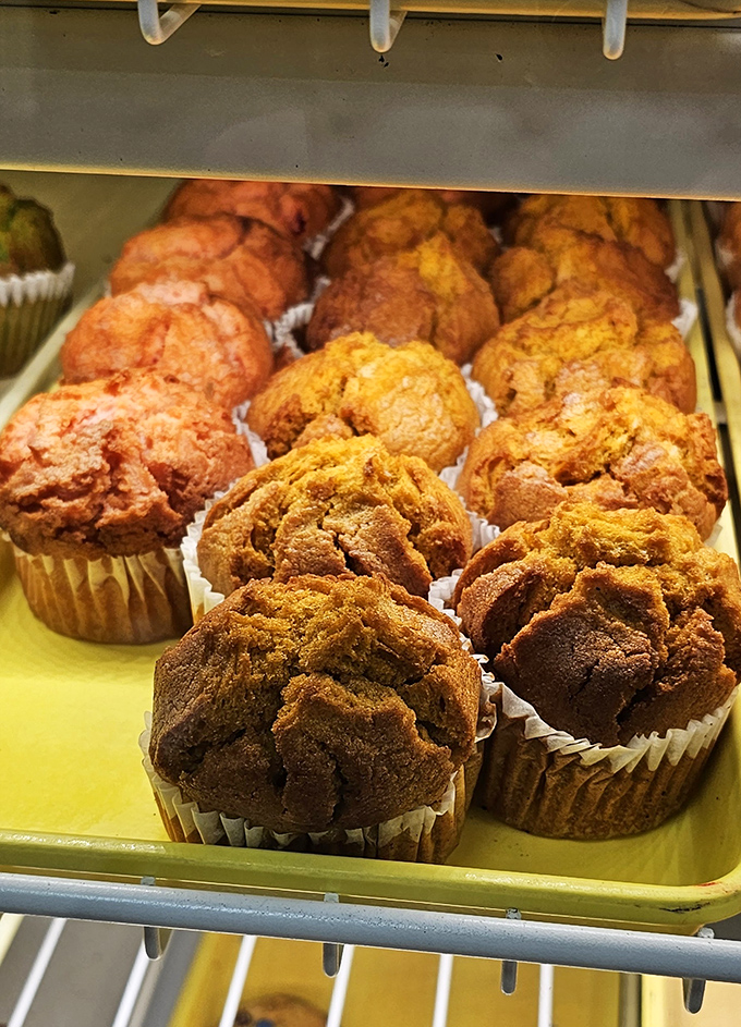 Fresh muffins crowned with golden tops promise that perfect balance of cake and comfort in every bite.