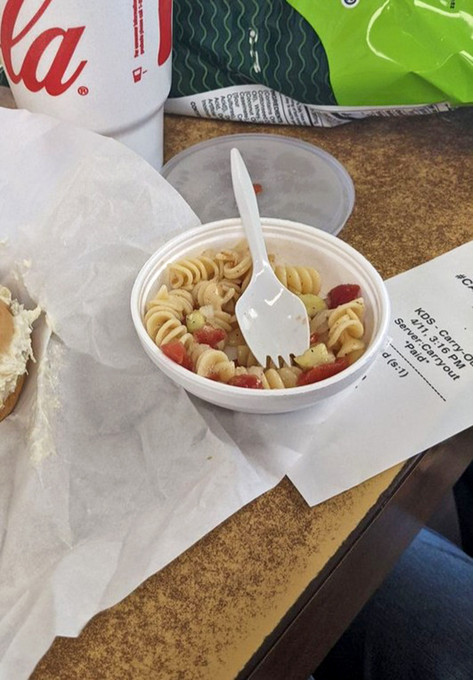 Side dish diplomacy! This pasta salad brings a refreshing counterpoint to the savory sandwiches, proving that supporting actors matter too.