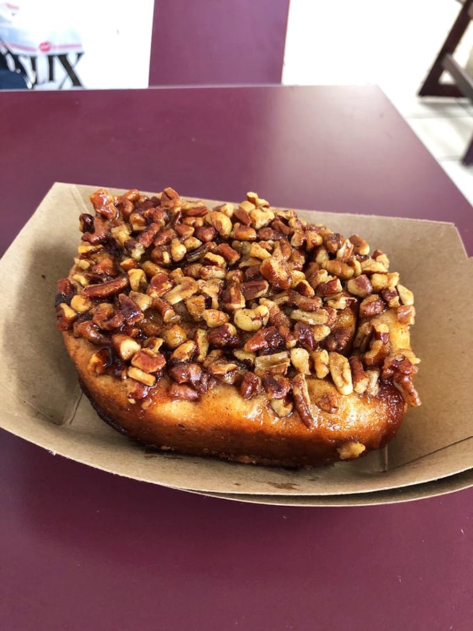 Pecan perfection that would make Southern grandmothers nod in approval. The generous topping of buttery, caramelized nuts transforms this roll into edible art.