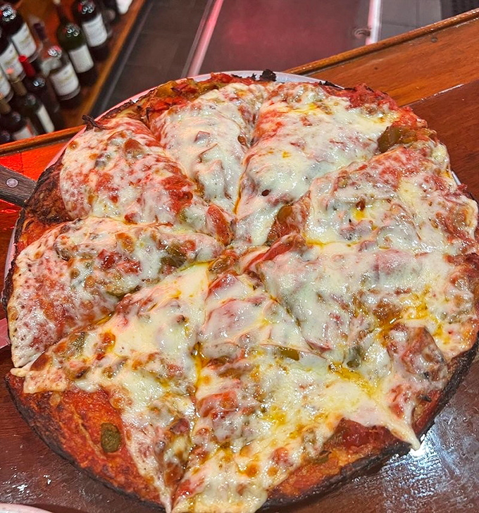 This isn't Instagram pizza; it's the real deal&mdash;bubbling cheese, substantial crust, and that sauce that haunts your dreams.