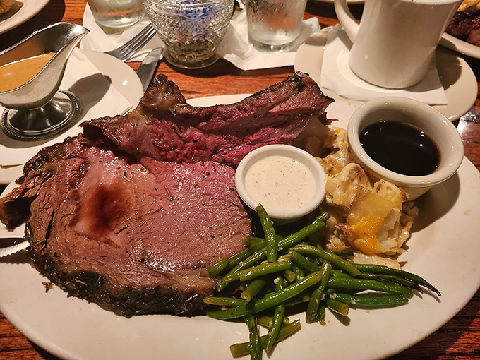 A plate that answers the eternal question: "Why choose between steak and ribs?" The green beans are there to maintain the illusion of balance.