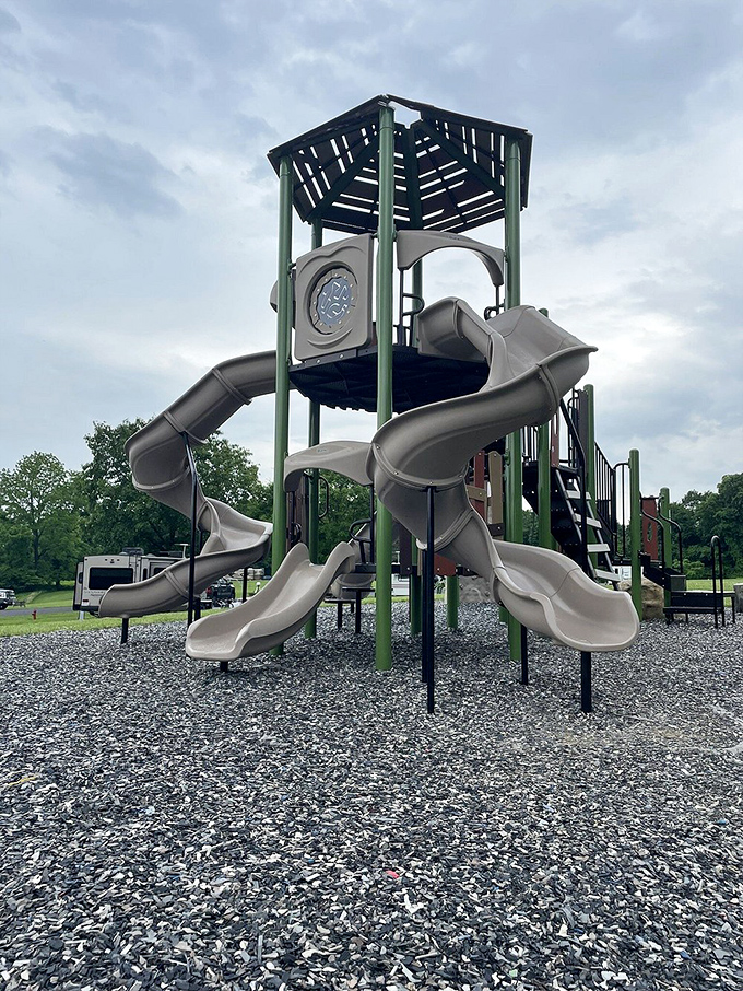 Childhood joy engineered in plastic and steel. This playground promises the kind of exhausted-kid bedtimes parents secretly celebrate.