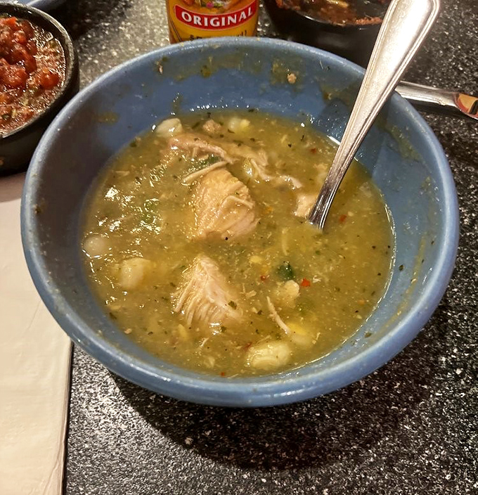 This isn't just soup&mdash;it's liquid comfort. Tender chunks of pork swimming in a green chile broth that warms you from the inside out.