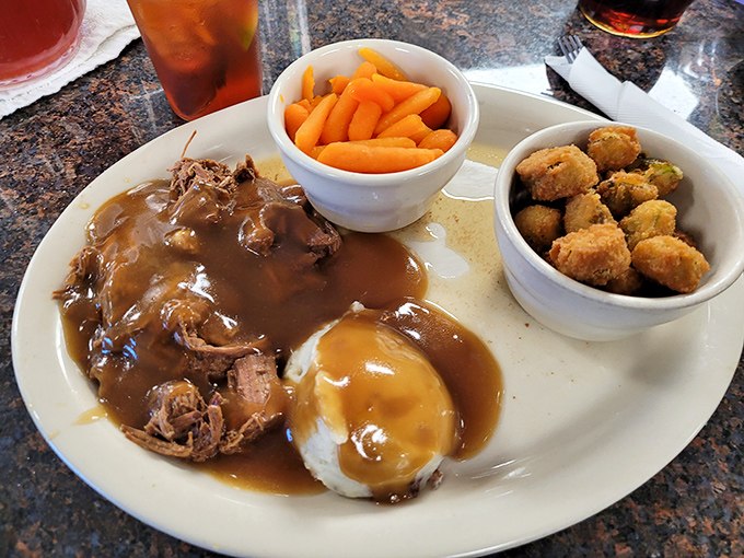 Pot roast that doesn't need a knife, just a gentle nudge from your fork. That gravy has clearly been simmering since dawn, possibly since yesterday.
