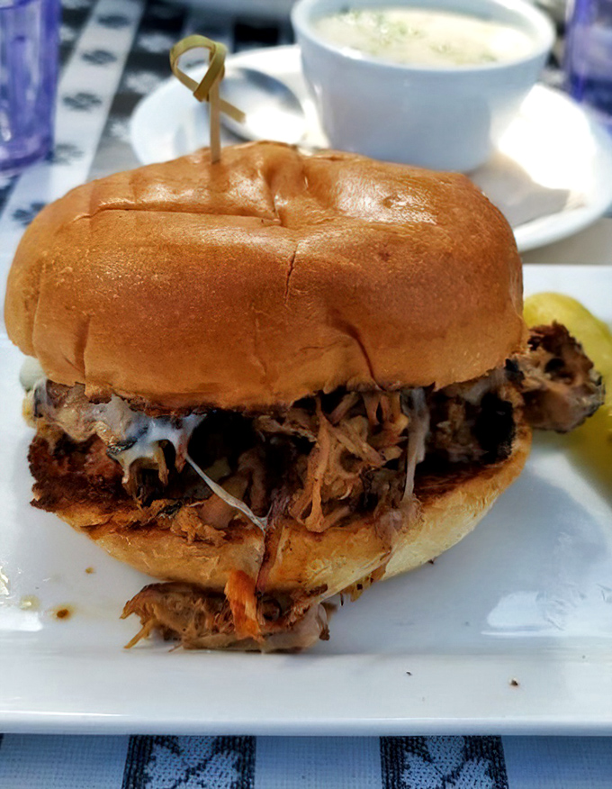This isn't just a pulled pork sandwich; it's a commitment to excellence held together by a bun. The side of soup suggests they understand balance in all things.