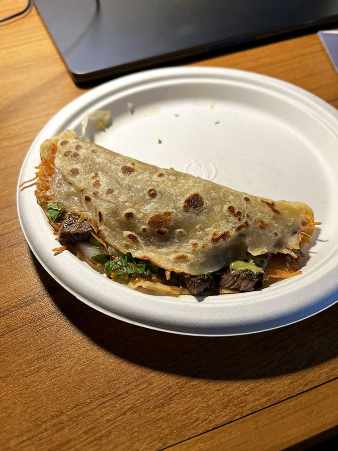 The humble quesadilla, elevated to art form&mdash;crispy, cheese-laden edges giving way to a tender center filled with savory treasures.