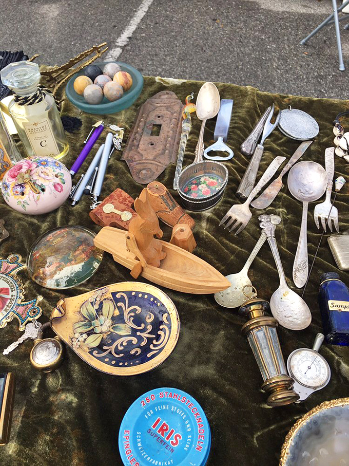 A velvet tableau of everyday treasures transforms ordinary utensils into archaeological finds. That silver fork? Possibly used by royalty (or at least someone's fancy aunt).