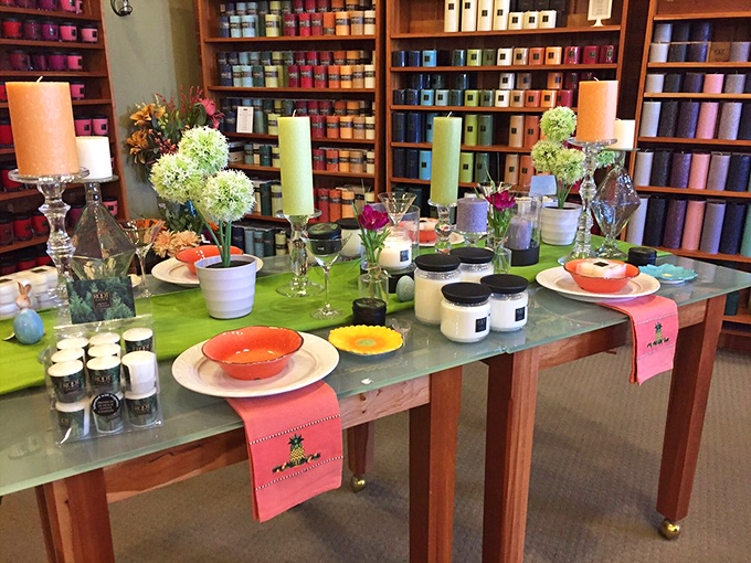 A tablescape that belongs in a magazine spread. The vibrant linens and carefully arranged candles showcase how light transforms an ordinary dinner into an occasion.