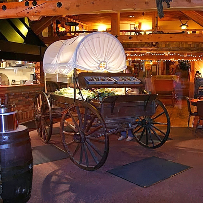 Not just any salad bar—this covered wagon display turns the humble pre-steak ritual into part of the frontier experience.