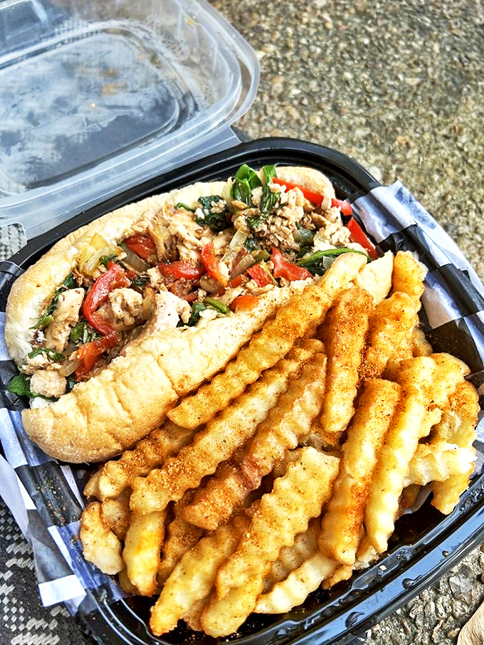 Sandwich nirvana! This seafood-packed hoagie with seasoned fries proves Delaware knows how to elevate the humble sandwich.