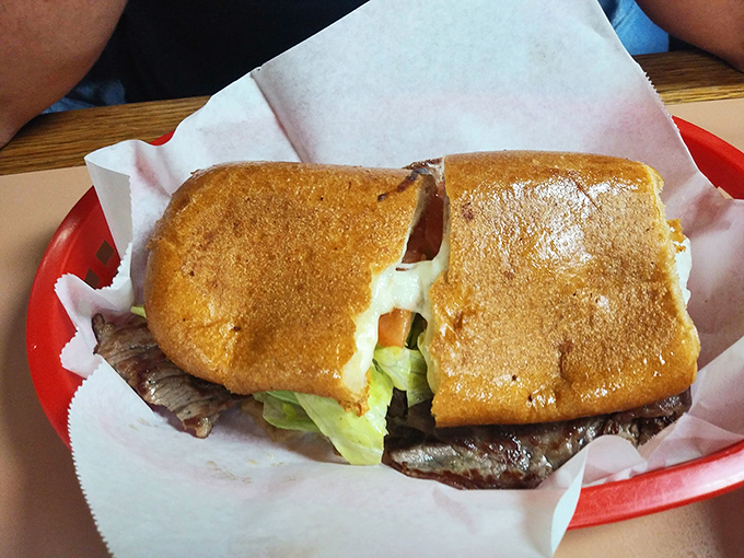 This torta isn't just a sandwich; it's architecture. Crispy bread supporting layers of flavor that somehow defy gravity and good sense.