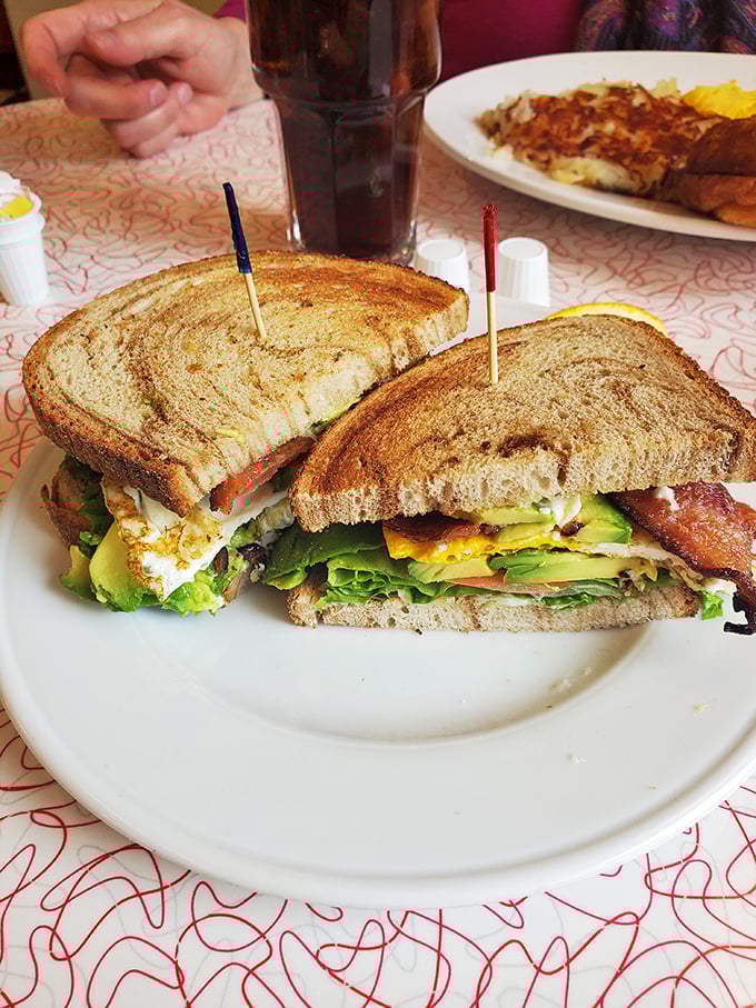 This isn't just a sandwich&mdash;it's an architectural marvel of crispy toast, fresh veggies, and layers that would make a geologist jealous.