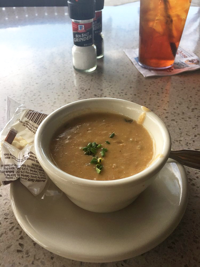 She-crab soup: where cream, crab, and sherry perform a delicate ballet that warms the soul and quiets conversation.