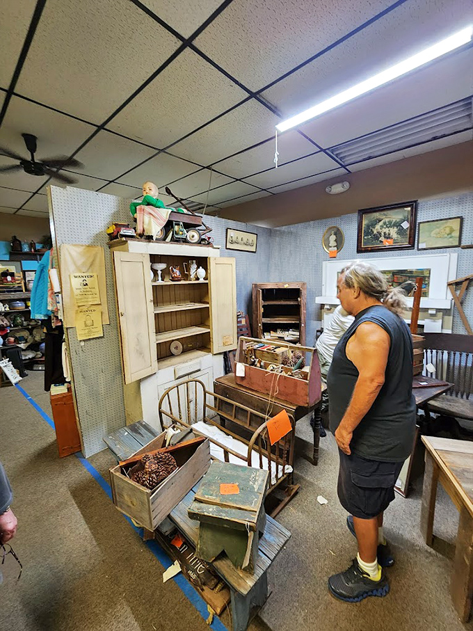The treasure hunt in action. Every antique store explorer knows that perfect moment of discovery is worth the journey through aisles of history.
