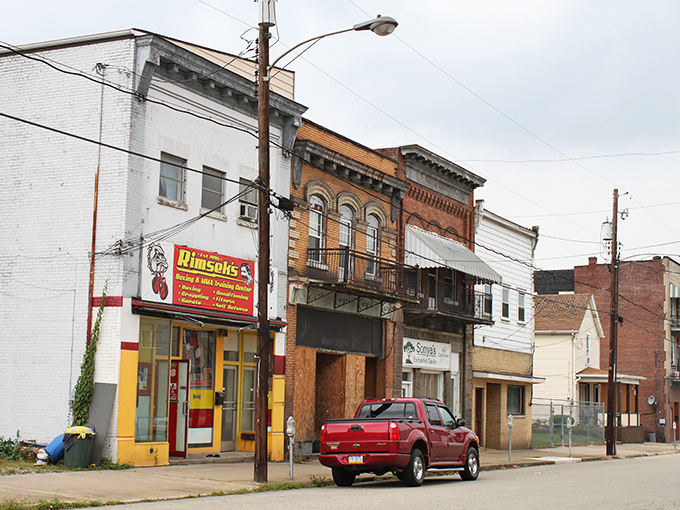 These storefronts have weathered economic storms with the same resilience as the people who shop there—a bit worn but standing proud.