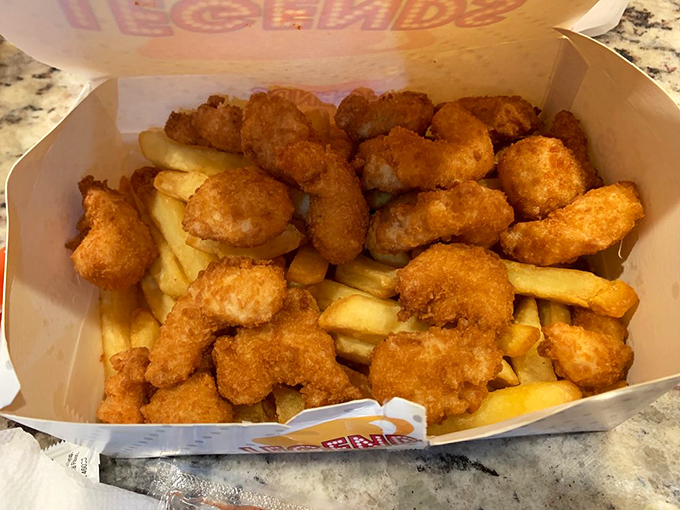 Crispy nuggets nestled among golden fries&mdash;proof that sometimes the simplest combinations are the ones that bring the most joy.