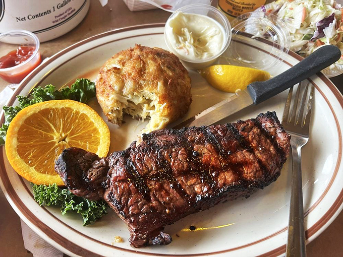 Surf meets turf in perfect harmony&mdash;a perfectly charred New York strip alongside a golden crab cake that refuses to be upstaged.