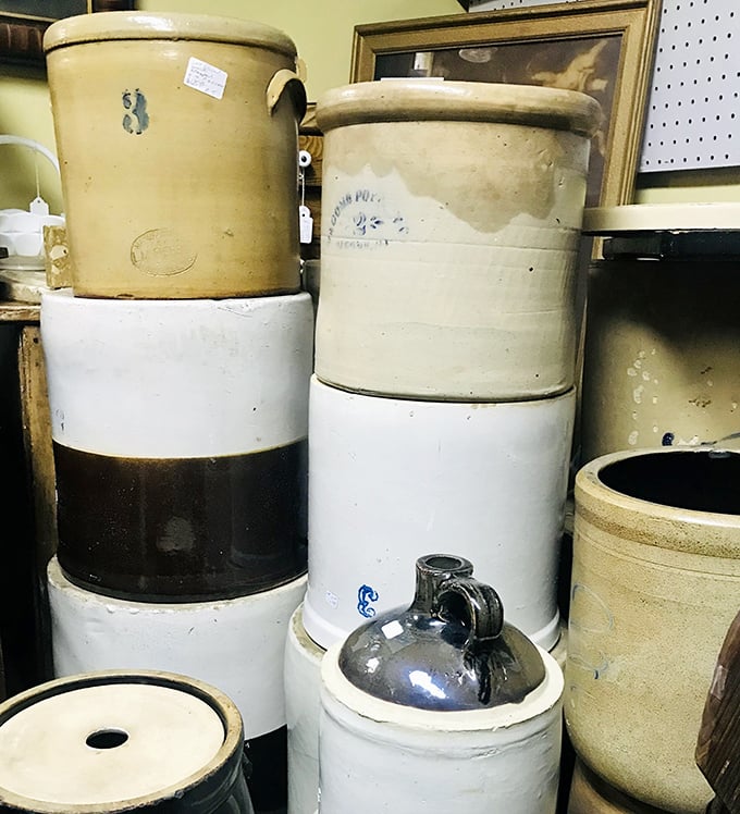Stoneware crocks that once preserved winter's bounty now preserve memories, stacked like ceramic time capsules from America's farmhouse kitchens.