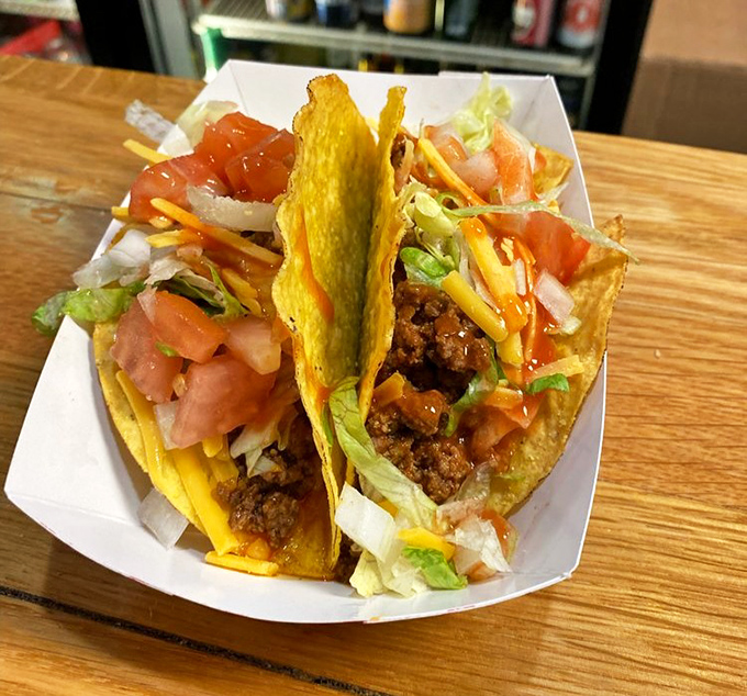 Taco Tuesday is every day here. These crispy shells cradle seasoned meat and fresh toppings like tiny flavor hammocks designed by someone who truly gets it.