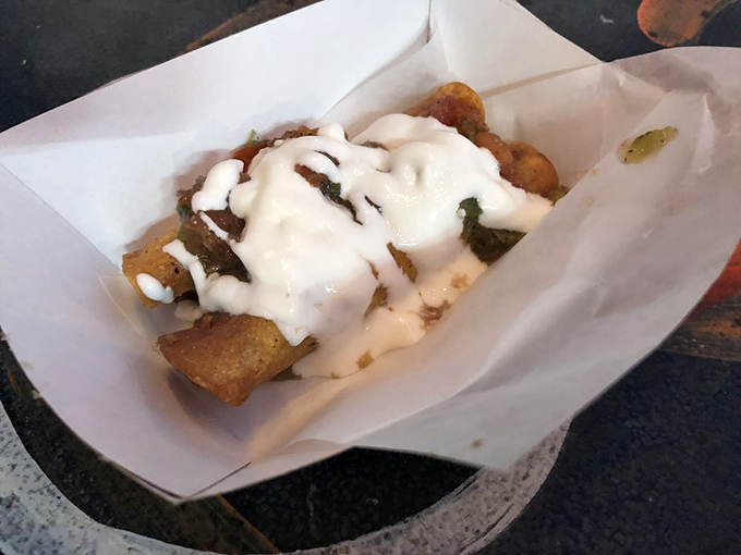 The white sauce drizzle is like the final brushstroke on a masterpiece. Some artists work with oils and canvas; these folks work with batter and tortillas.