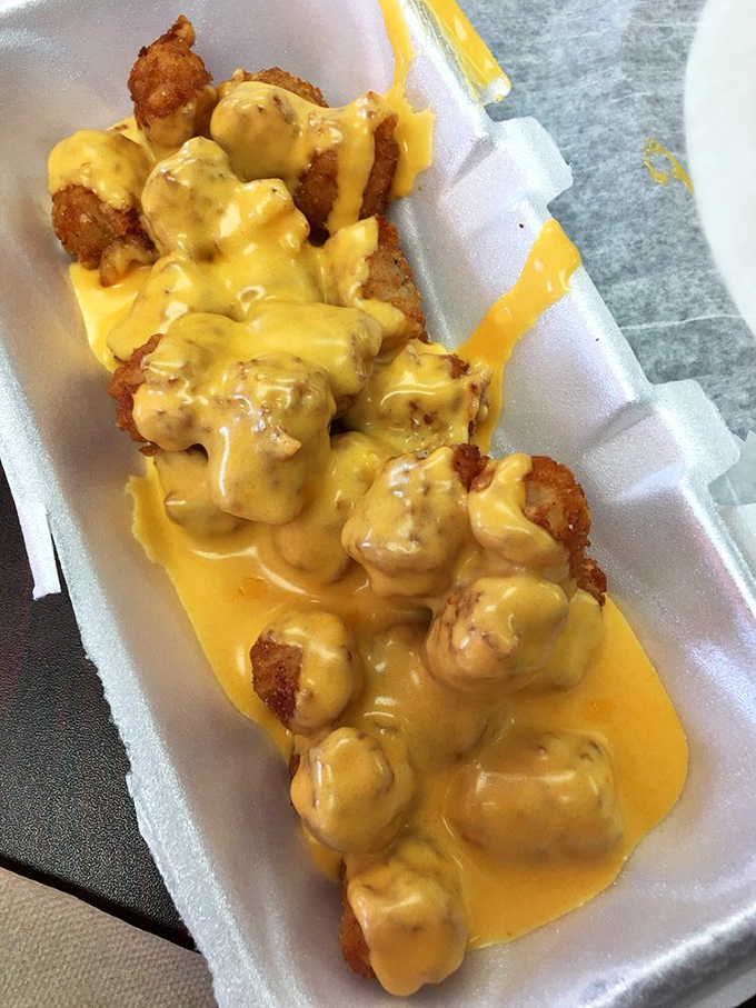 These cheese-smothered tater tots aren't just a side dish &ndash; they're a commitment to happiness in potato form.