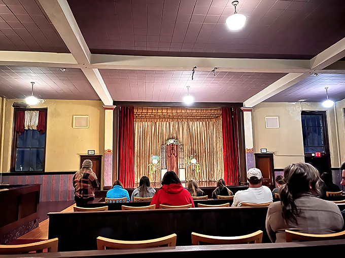 The intimate theater where entertainment once boosted military morale now hosts visitors eager for a different kind of escape.