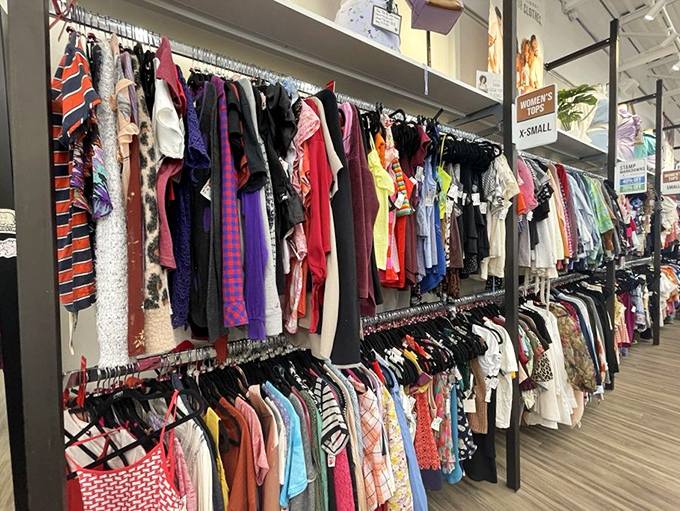 A rainbow of fabrics tells a thousand style stories. Each hanger holds a previous life and awaits its next chapter.