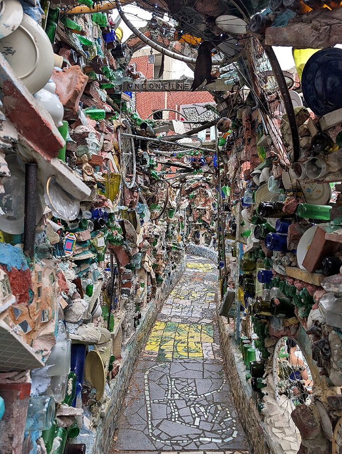 Narrow pathways lead to unexpected discoveries, like Alice's Wonderland reimagined by someone with a serious bottle collection and unlimited grout.
