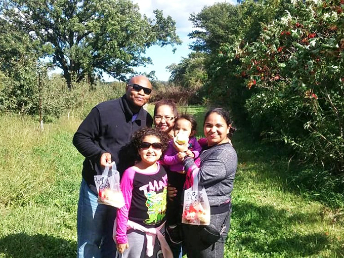 Families discover the simple joy of apple picking together. These aren't just apples being harvested—they're memories that will ripen with time.