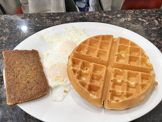 This golden waffle isn't trying to be trendy or reinvent itself. It knows exactly what it is: breakfast perfection with those crispy edges and fluffy squares.