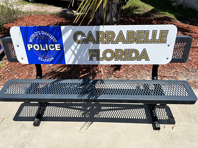 Even the world's smallest police station needs a waiting area - complete with commemorative bench seating.