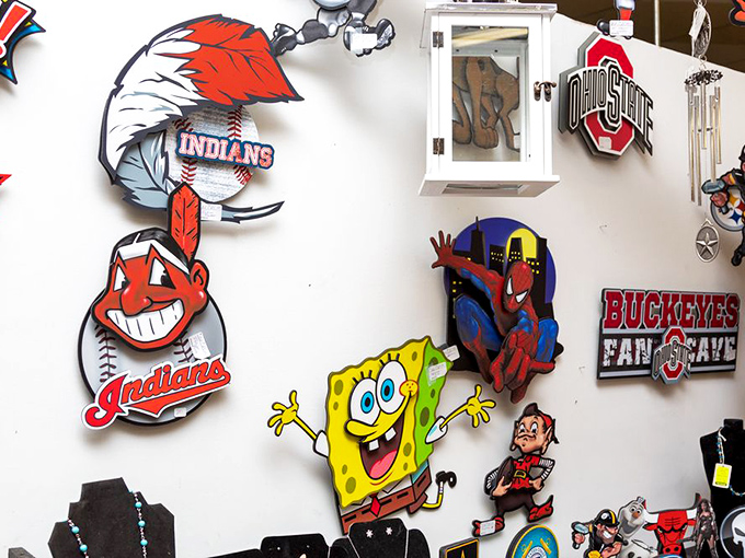 Ohio pride on full display! From Chief Wahoo to Buckeye banners, this wall captures the sports devotion that runs deeper than Lake Erie.