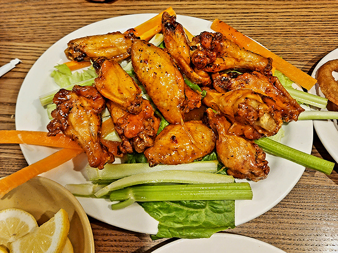 These wings aren't flying anywhere except straight to your taste buds. Crispy, saucy perfection perched on a bed of fresh veggies.