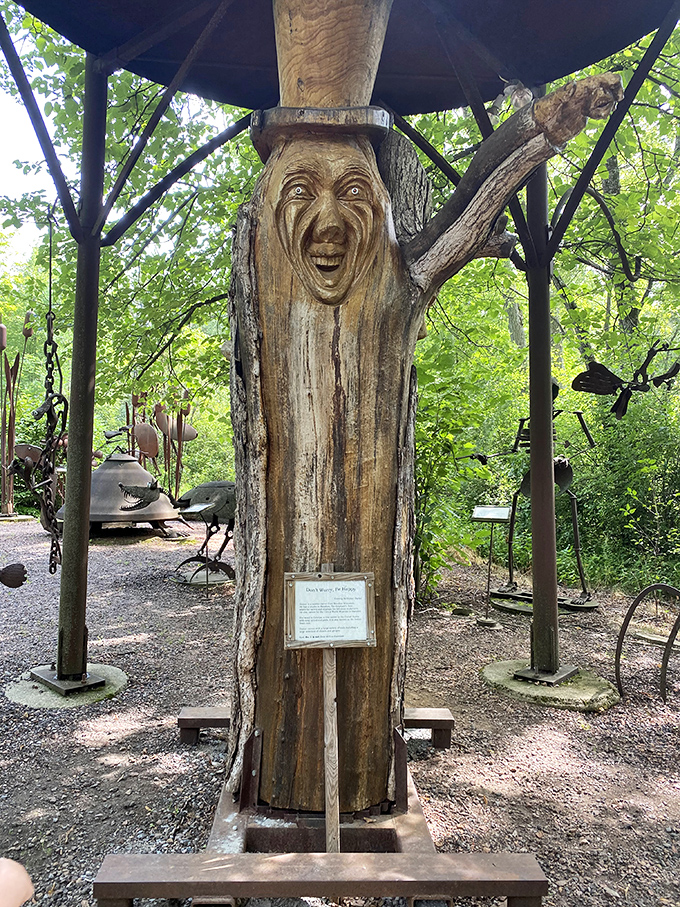"I am Groot's eccentric cousin!" This expressive wooden face carved from a tree trunk seems to be sharing secrets with everyone who passes by.