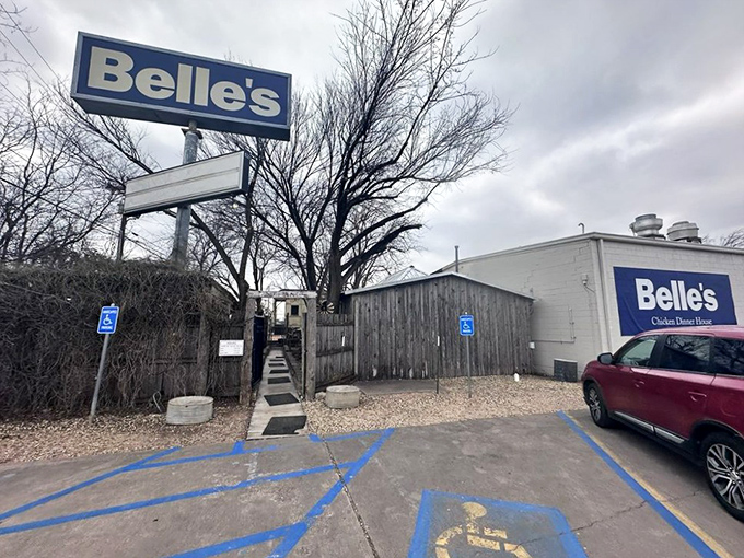 Don't let the humble exterior fool you&mdash;chicken legends are born in unassuming places. That sign stands tall like a promise.