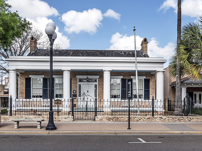 That historic home isn't just preserved &ndash; it's living and breathing Brownsville history with a white-columned smile.