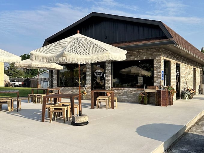 Cheeky Doughnuts' stone exterior and patio seating create the perfect backdrop for Wisconsin's favorite summer activity: donut appreciation in the sunshine.
