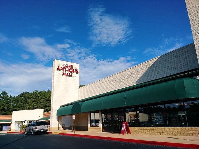 Cobb Antique Mall's bold signage stands out against the blue Georgia sky. A beacon for collectors and casual browsers alike.