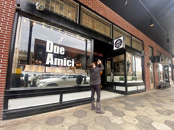 Due Amici's classic black signage promises "REAL NY PIZZA" without the subway fare. The kind of place that makes transplanted New Yorkers weep with joy.