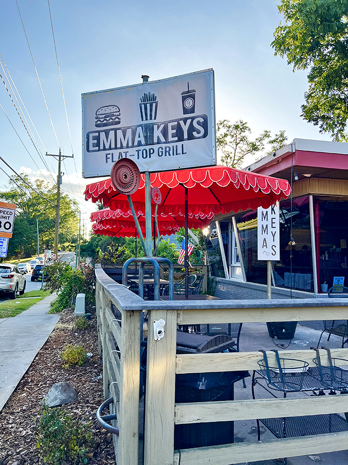 Emma Key's bright red awnings signal burger joy ahead. That vintage-style sign promises flat-top perfection awaits inside.