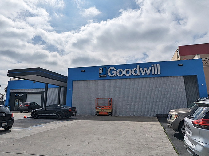 Goodwill's Sunset Boulevard location stands bright blue against the LA sky, a beacon for bargain hunters.