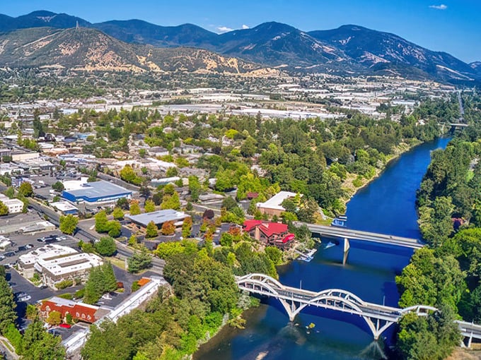 "Bridges to somewhere wonderful! Those twin spans over that impossibly blue river make Grants Pass look like a postcard come to life."