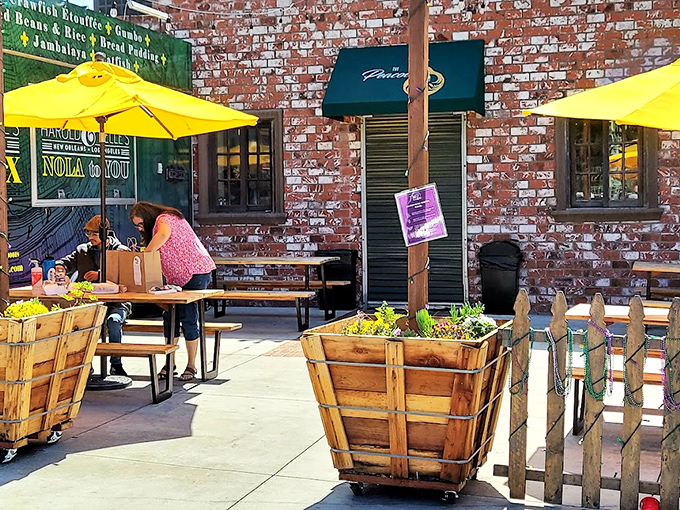 Harold & Belle's rustic brick exterior and wooden planters create the perfect New Orleans vibe in the heart of LA.