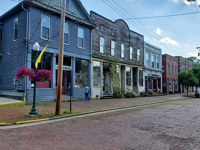 Brick streets and flower boxes create a symphony of textures that modern pavement just can't match.