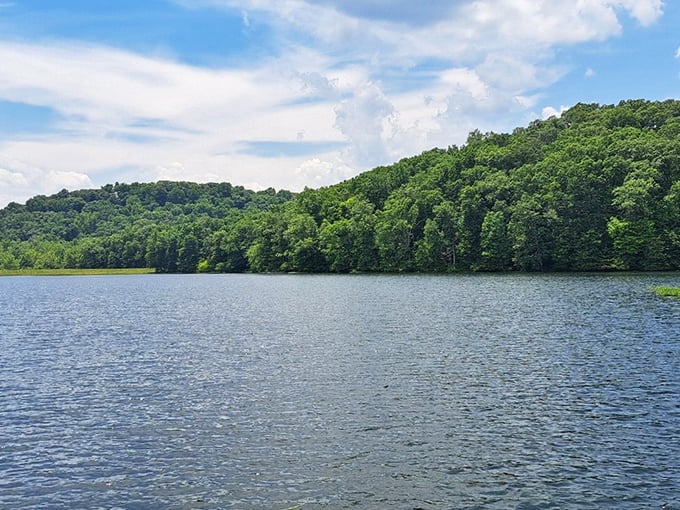 Take a moment to relax by the shimmering water as lush green hills surround you in this peaceful Indiana escape.