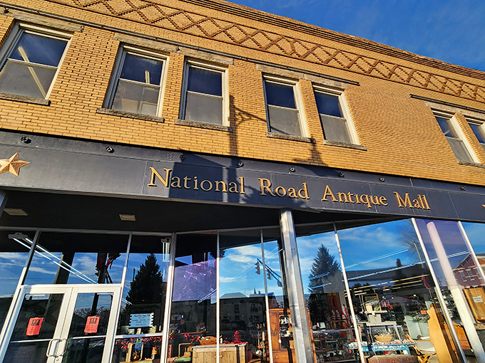 The National Road's golden brick sentinel stands watch in Cambridge City, guarding stories older than your grandparents.