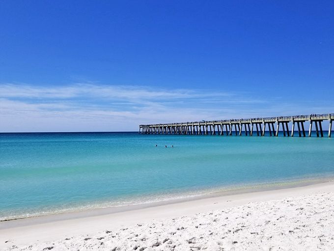 Navarre Beach's pristine shoreline stretches like an empty canvas waiting for footprints, sandcastles, and afternoon naps.