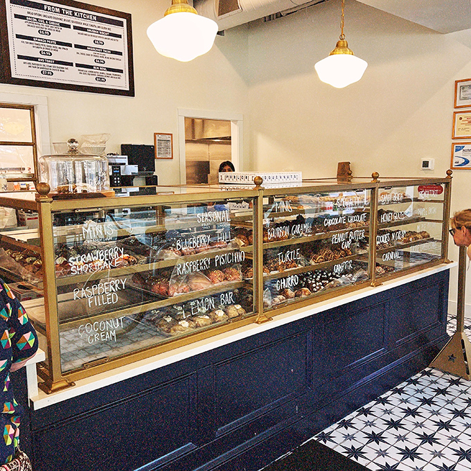 The display case at Parlor Doughnuts reads like a delicious choose-your-own-adventure novel. Raspberry Pistachio or Bourbon Caramel? Plot twist: get both.