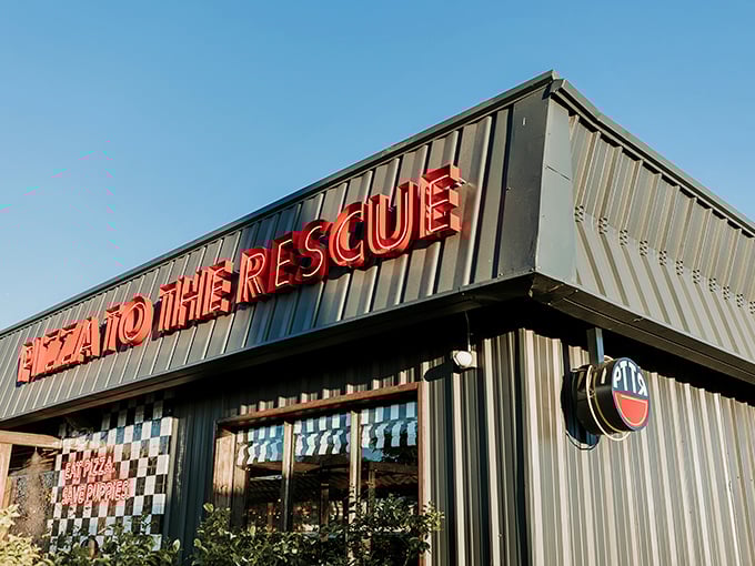 "Pizza To The Rescue" isn't just a clever name &ndash; it's a promise delivered in bold red letters against the Phoenix sky.