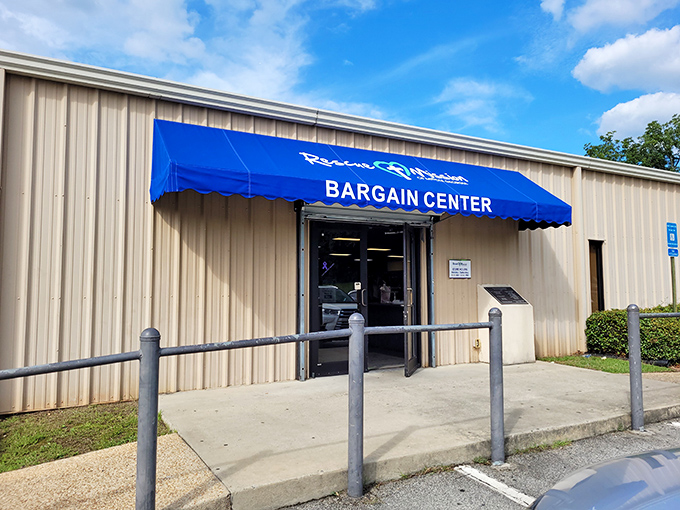 The Rescue Mission's Bargain Center wears its blue awning like a friendly smile, inviting shoppers to discover treasures within.